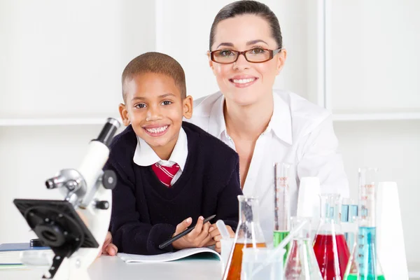 Elementary science teacher and student - Stock Image - Everypixel