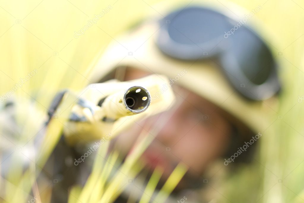 Soldier in helmet targeting with a gun Stock Photo by ©hurricanehank ...