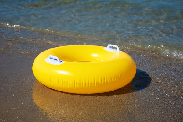 Yellow swim ring floating on a sea Stock Photo by ©Sergios 192027998