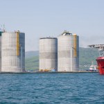 Tugs towing base offshore oil platform Stock Photo by ©Stas_K 11317504