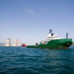 Tugs towing base offshore oil platform Stock Photo by ©Stas_K 11317504