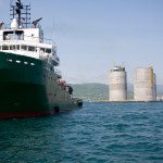 Tugs towing base offshore oil platform Stock Photo by ©Stas_K 11317504
