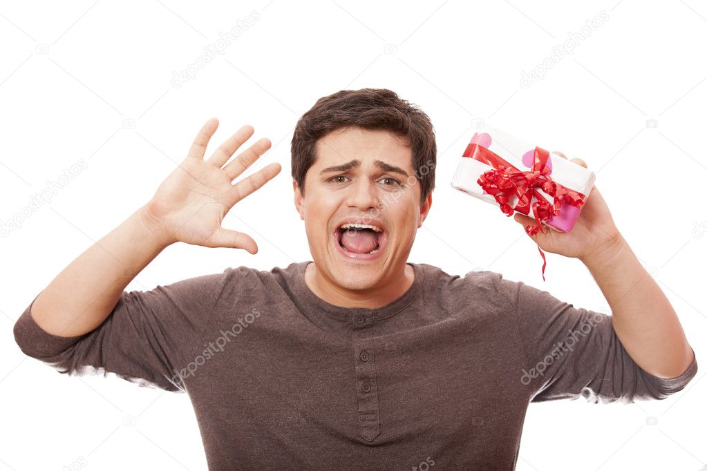An angry man holding present box on white background. Stock Photo by ...