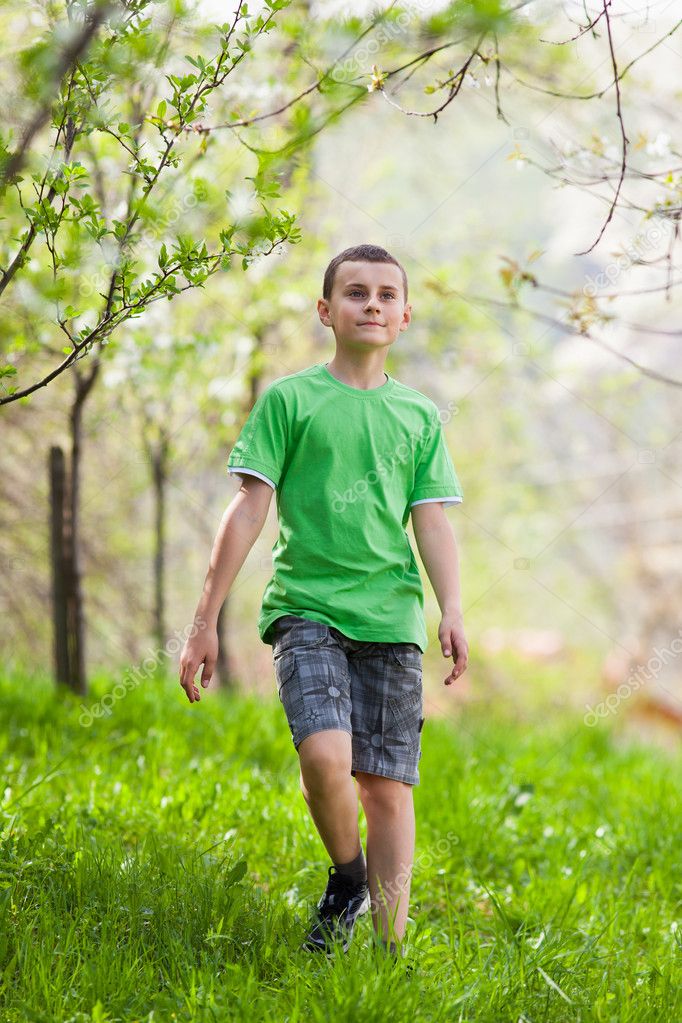 Boy walking outdoor — Stock Photo © Xalanx #10927198