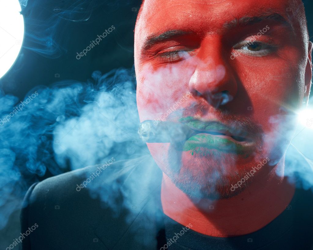 Angry man with red face smoking cigar. — Stock Photo © dontcut #11118935