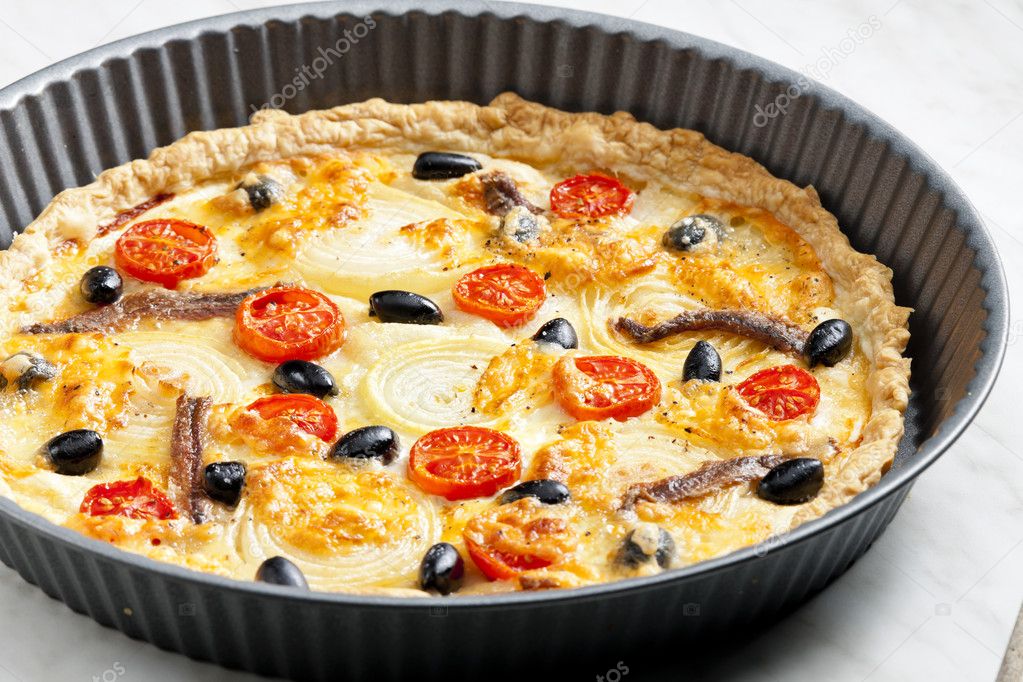 Cake with anchovies, cherry tomatoes and black olives Stock Photo by ...