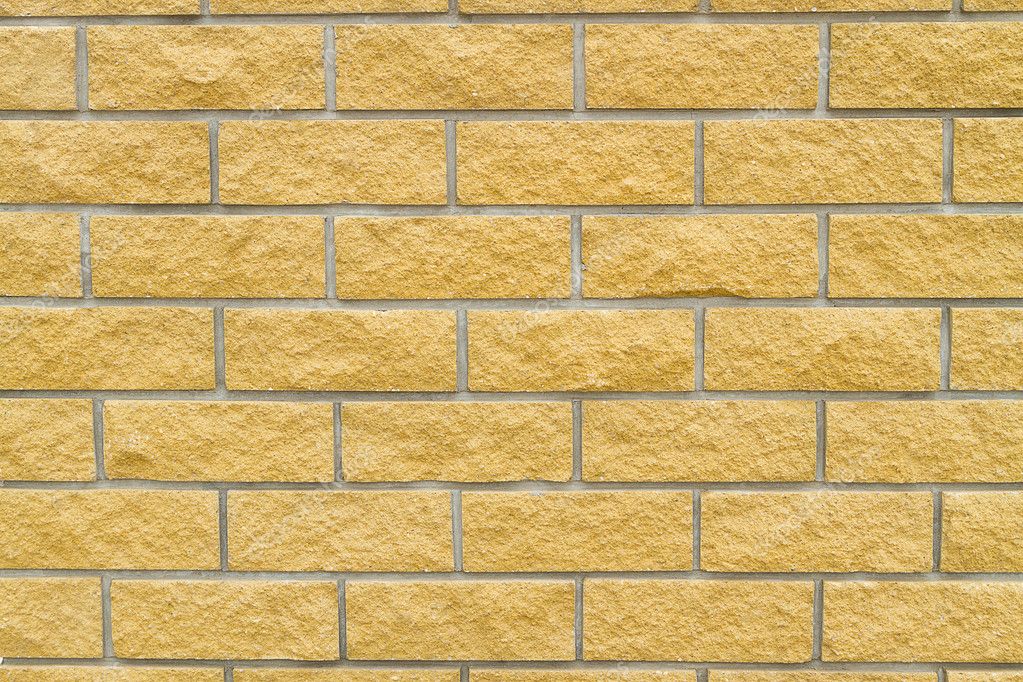 Brick wall of yellow stone — Stock Photo © ra3rn_ #11007343
