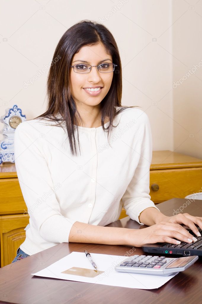 Beautiful young woman using computer at home — Stock Photo ...