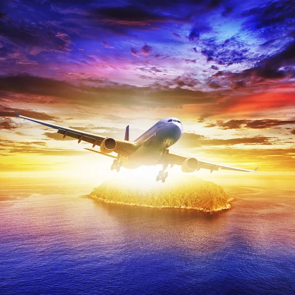 Jet plane over tropical island - Stock Image - Everypixel