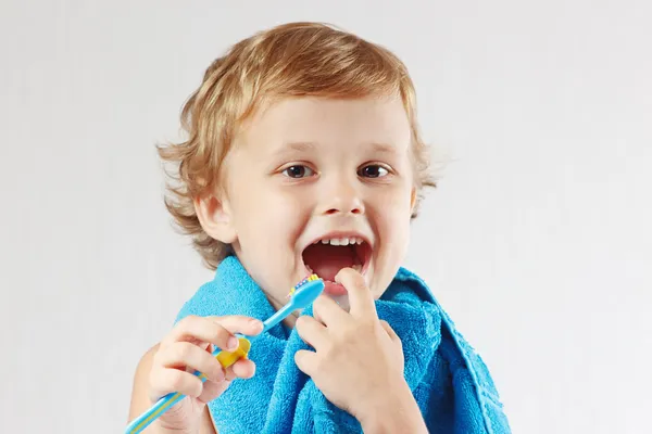 Young cute blond boy with toothbrush with pink toothpaste — Stock Photo ...