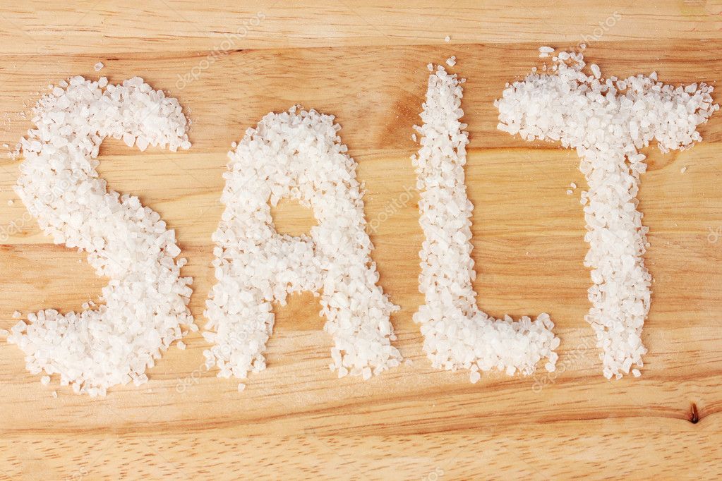 Sea salt on a cutting board close-up Stock Photo by ©belchonock 11139184