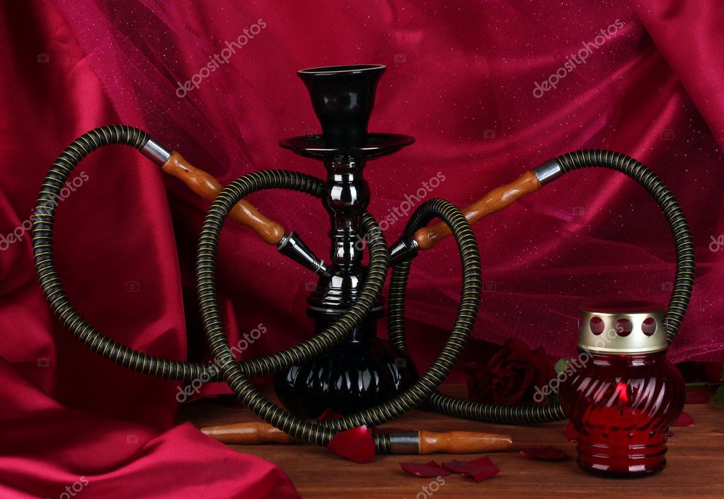 Hookah on a wooden table on a background of red curtain close-up Stock ...