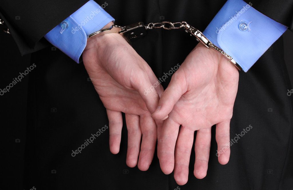 Businessman hands fettered with handcuffs Stock Photo by ©belchonock ...
