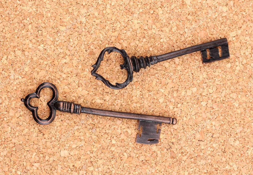 Two antique keys on cork background — Stock Photo © belchonock #11588206
