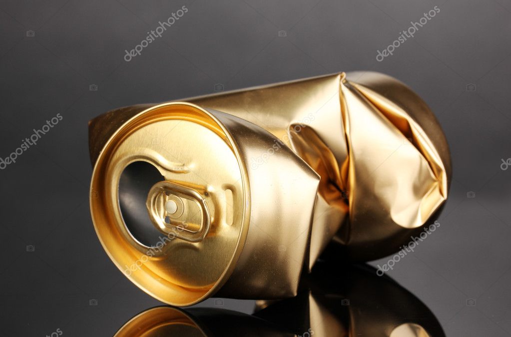 Crumpled empty can on grey background Stock Photo by ©belchonock 11962637