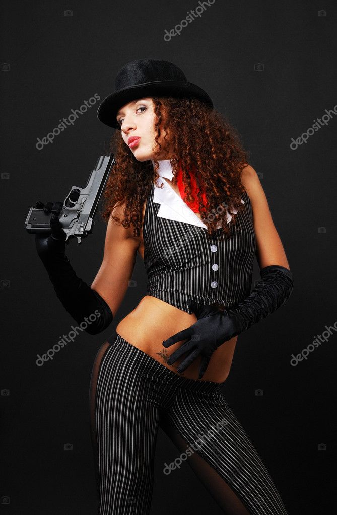 Pretty gangster with a handgun. Stock Photo by ©olegmit 11151947
