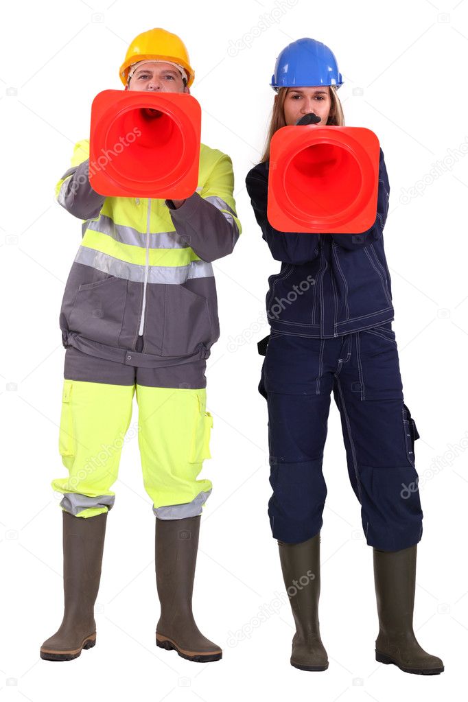 Two traffic workers shouting through cones — Stock Photo ...