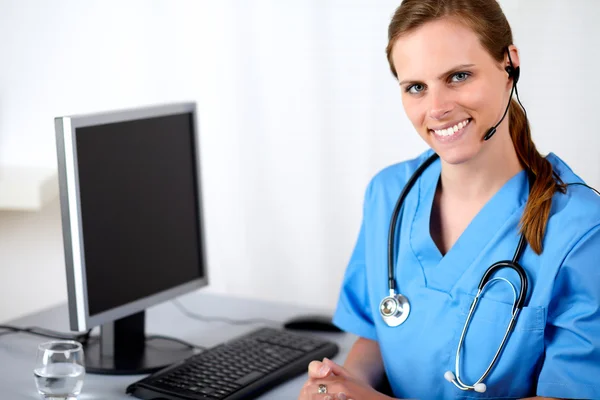 Caucasian medical secretary smiling - Stock Image - Everypixel
