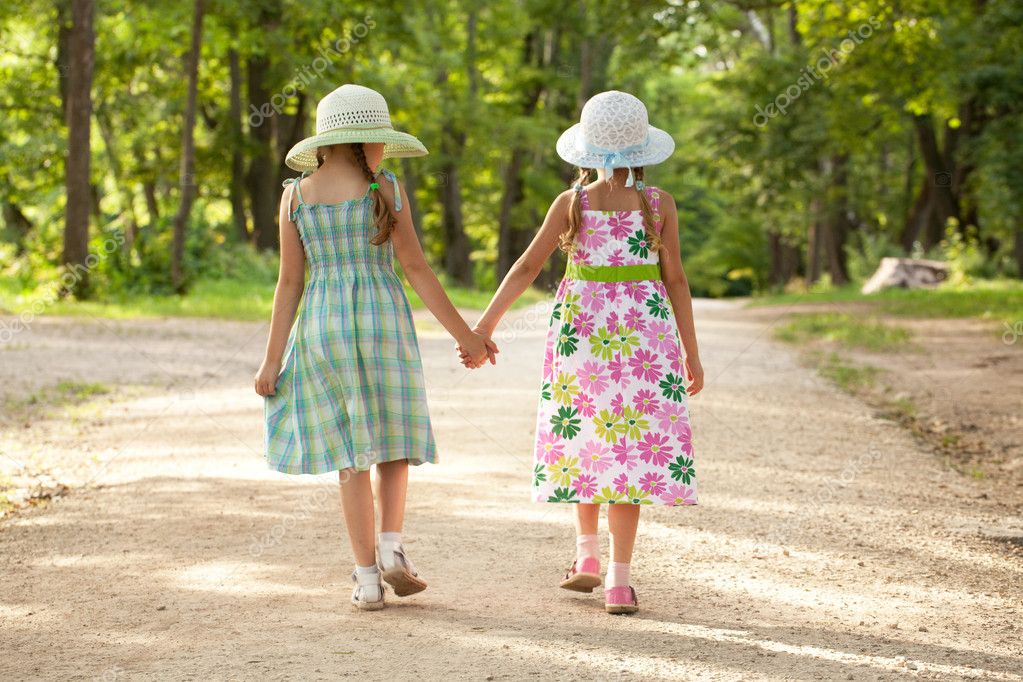 Two girls go hand in hand — Stock Photo © Dimedrol68 #12371218