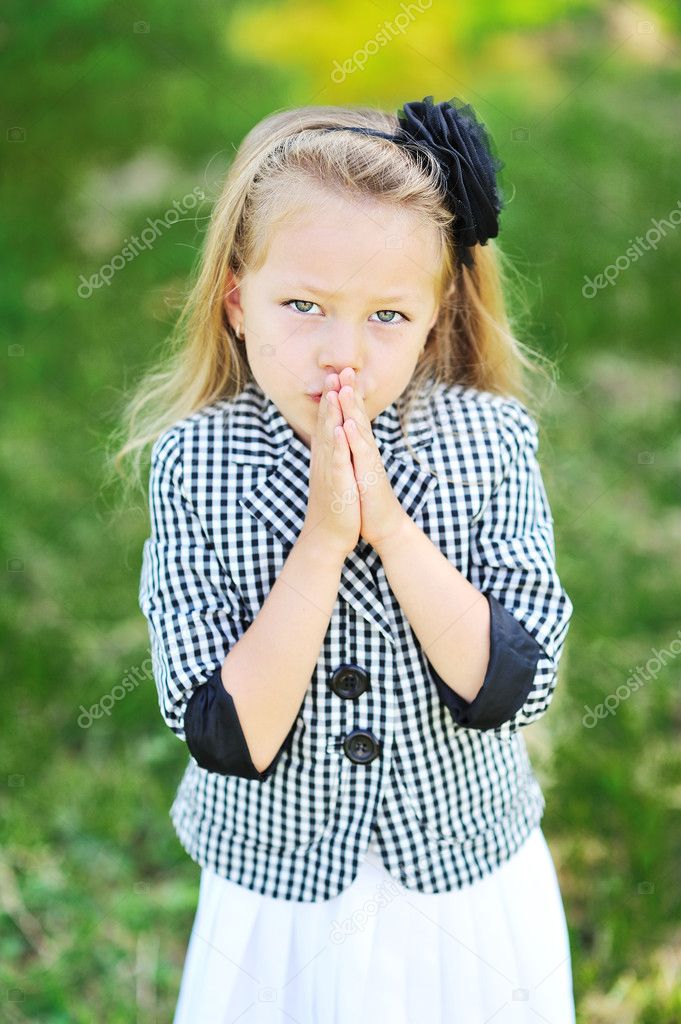 Little girl praying Stock Photo by ©paultarasenko 12072847