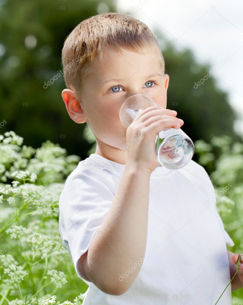 Child drinking pure water — Stock Photo © maxoidos #11597396