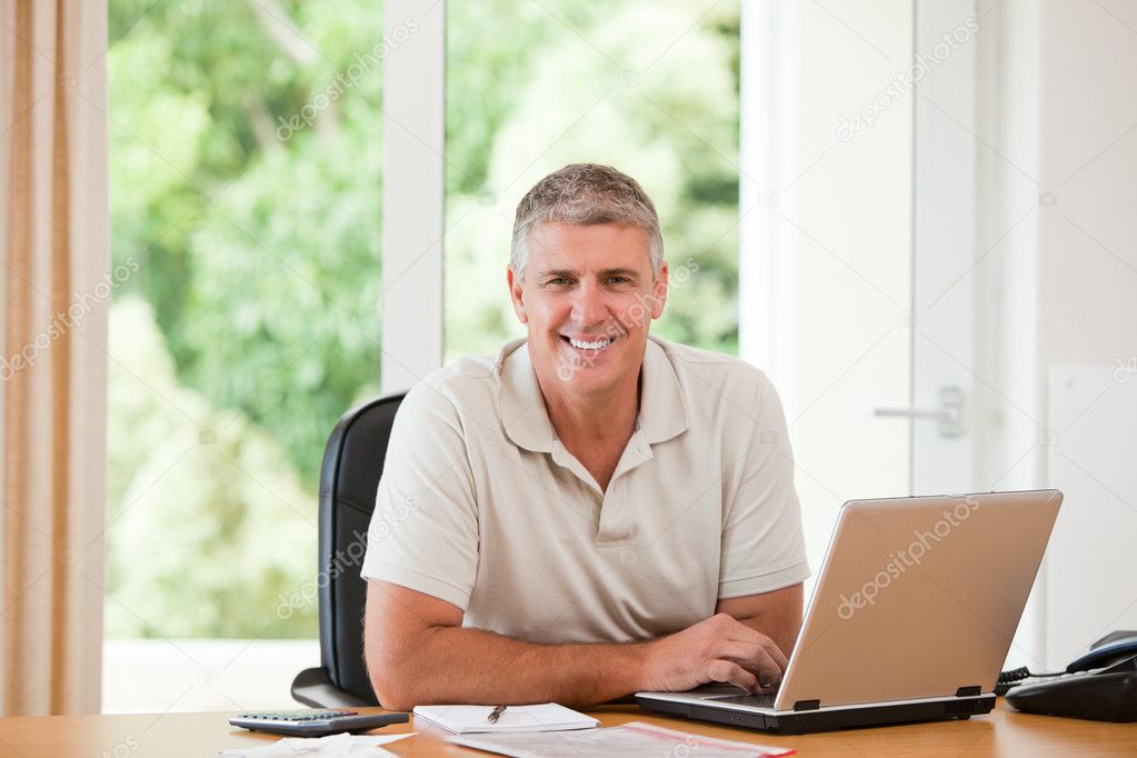 Man working on his laptop — Stock Photo © Wavebreakmedia #10847773