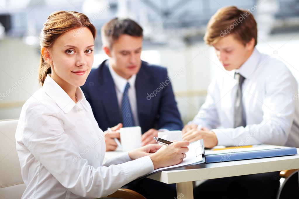 Secretary writing Stock Photo by ©pressmaster 11632389