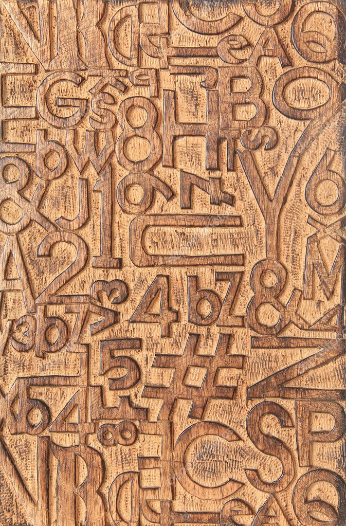 Wooden alphabet and numbers — Stock Photo © Hannamariah #11340393