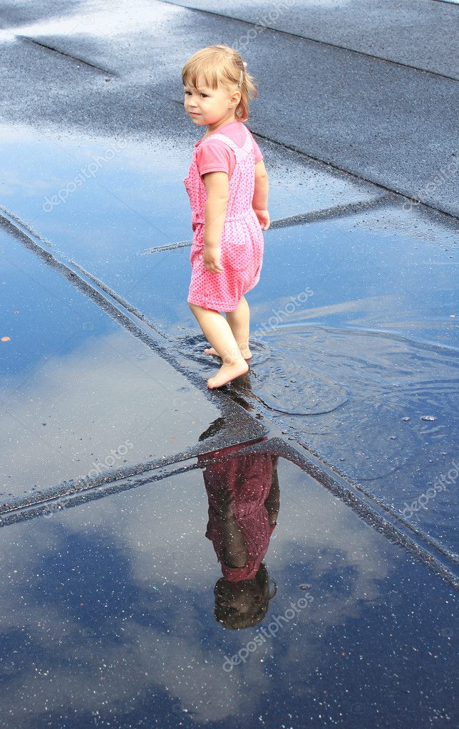 A beautiful little girl in the rain Stock Photo by ©Kostia777 11301839