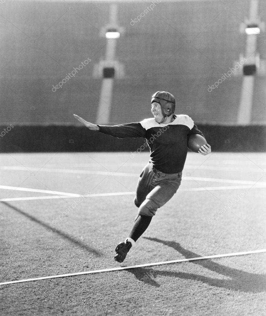 Football player running with ball — Stock Photo © everett225 #12289745